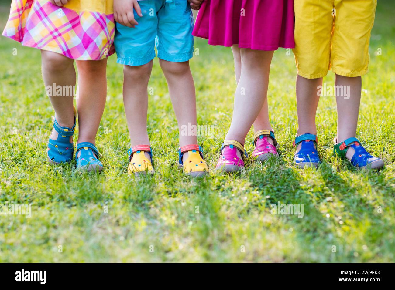 Footwear for children. Group of preschool kids wearing colorful leather ...