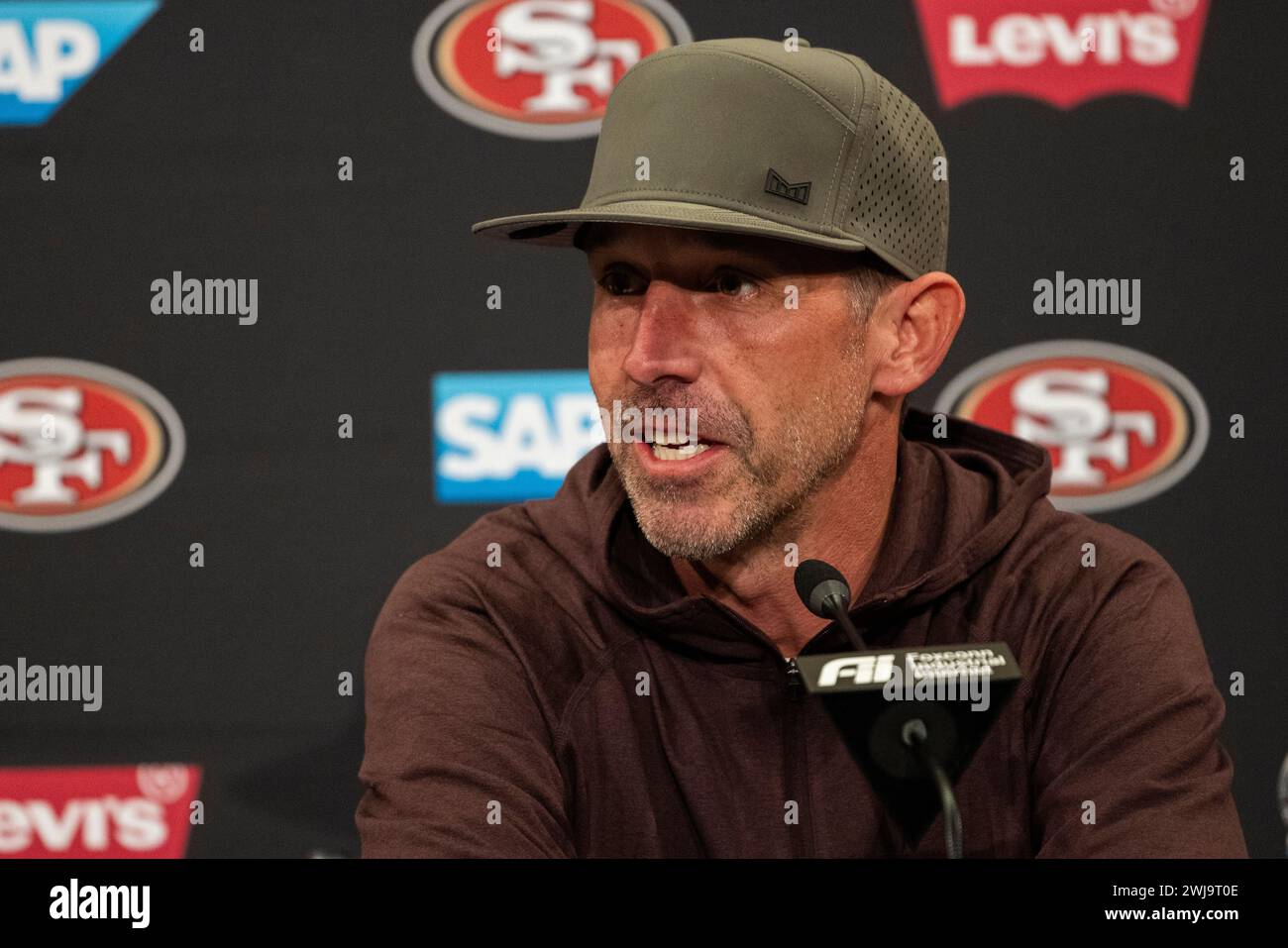 San Francisco 49ers head coach Kyle Shanahan speaks to members of the ...