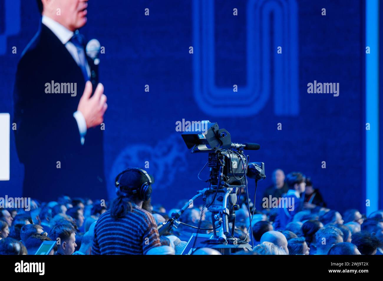 A speaker delivers a speech to a captivated audience at a professional ...
