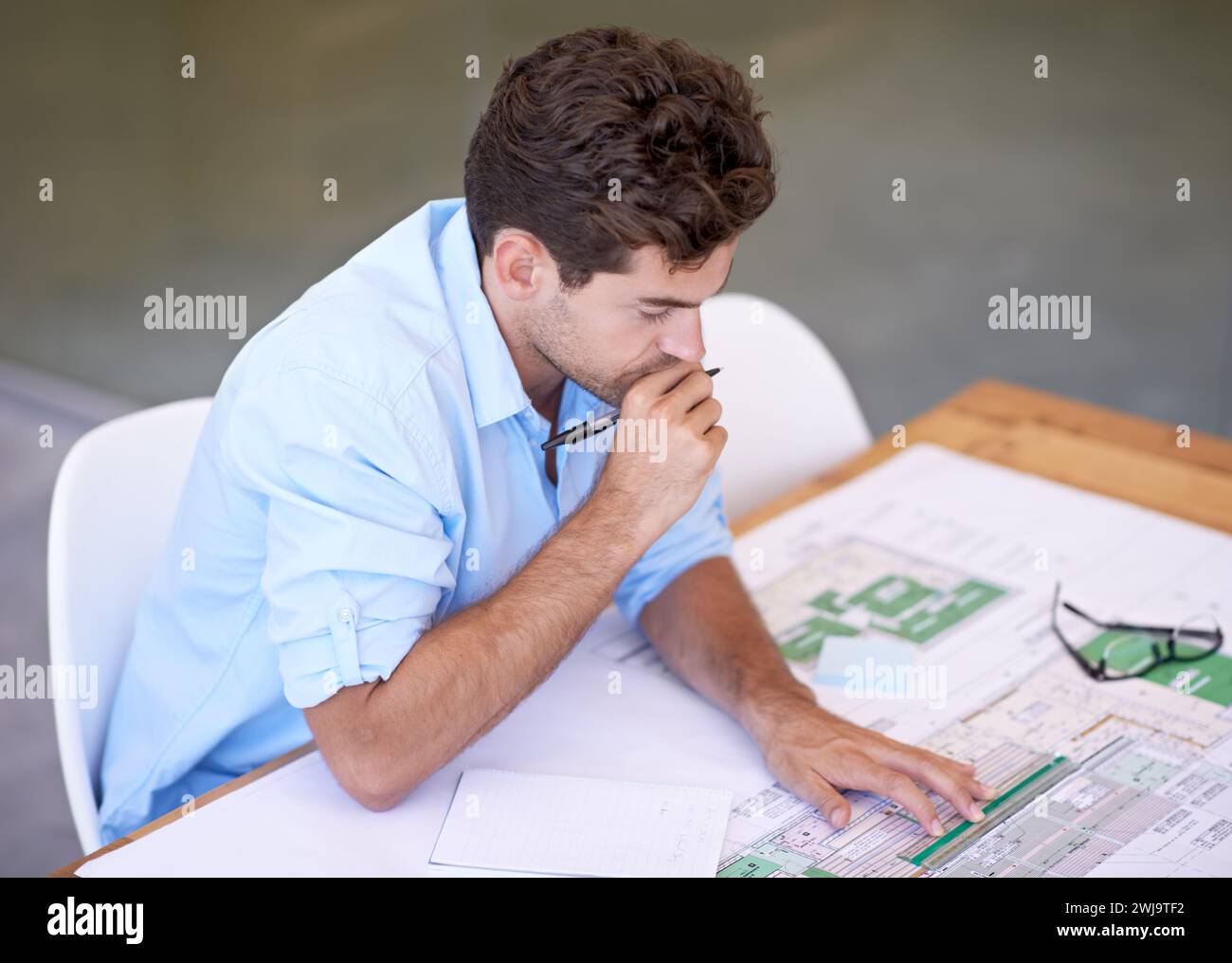 Architect, thinking or man in office with blueprint, brainstorming and ...