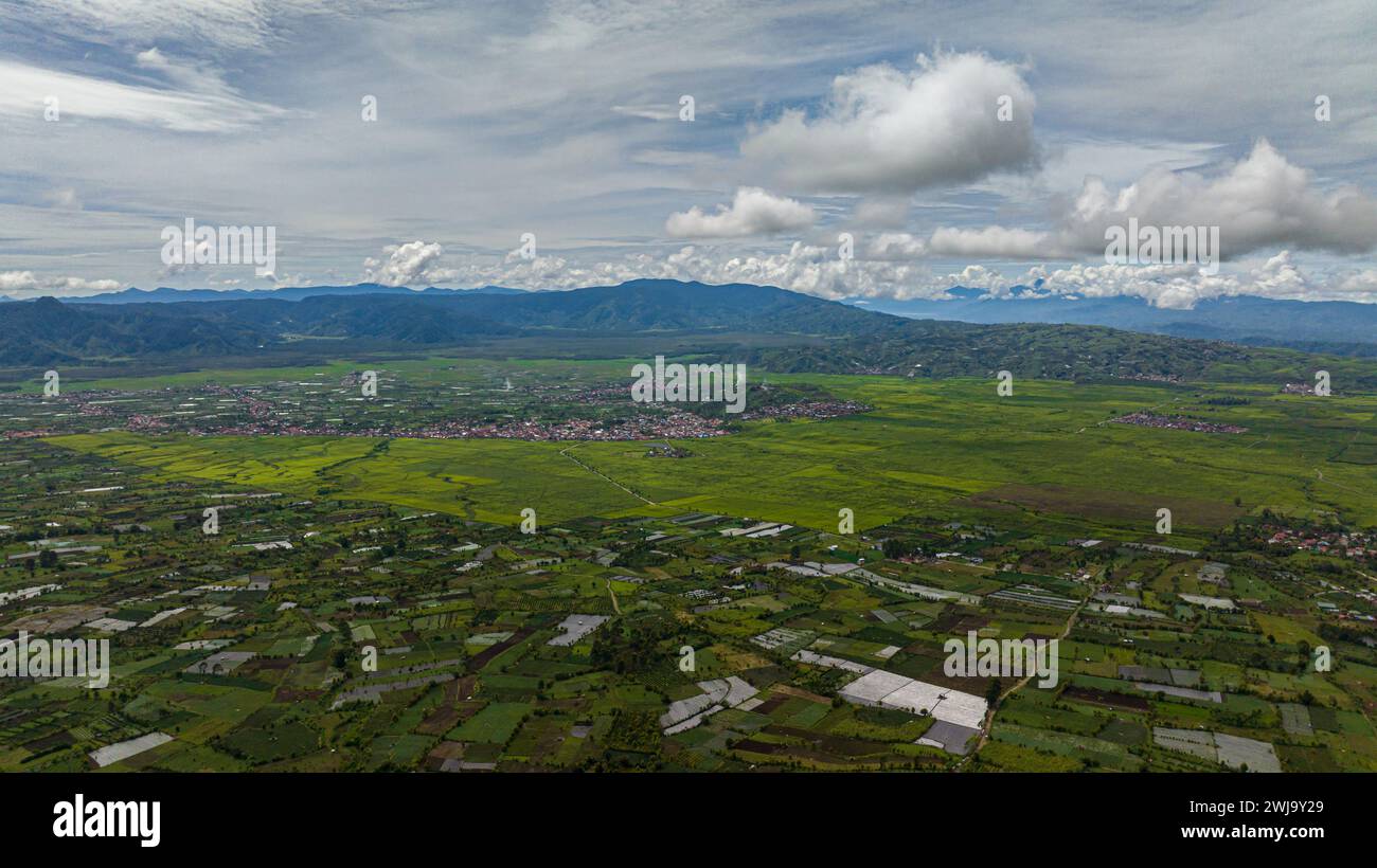 Aerial view of farm and agricultural land with crops in the mountainous ...