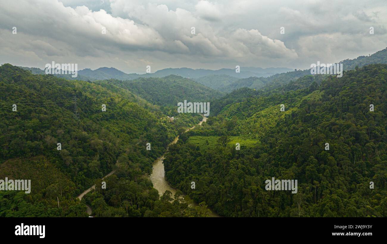 River among hills and mountains with rainforest. Sumatra, Indonesia ...