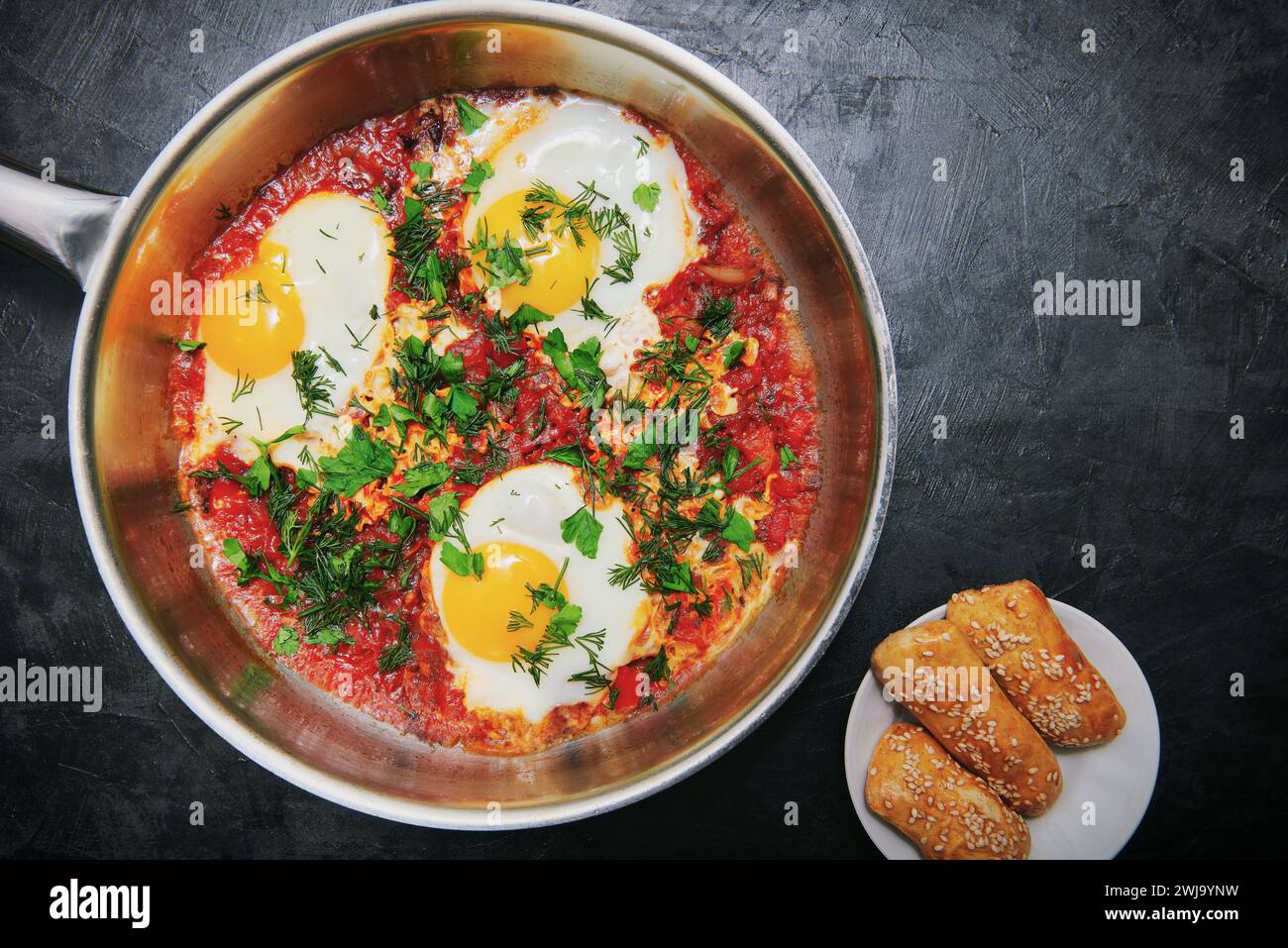 Tasty and healthy shakshuka, Middle Eastern omelet in a frying pan ...