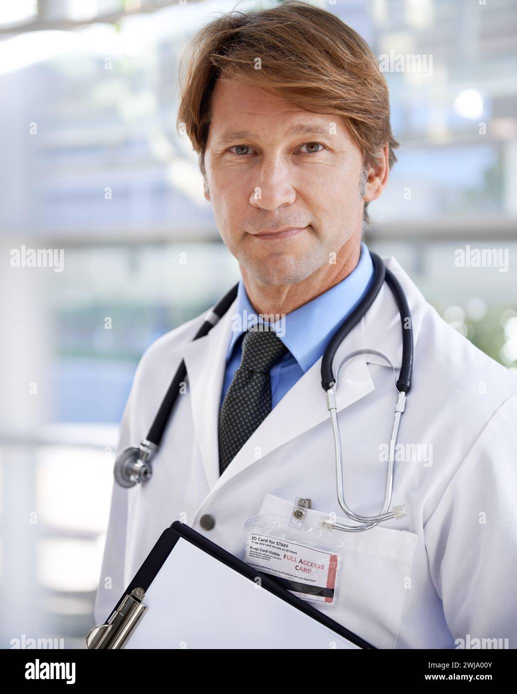 Portrait, doctor and clipboard in hospital for healthcare, documents or ...