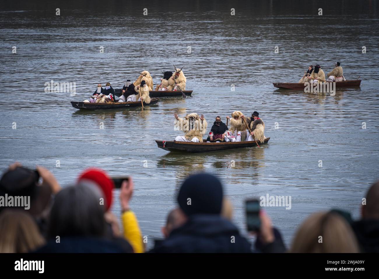 Mohács, Hungary - Feb 11 2024: Busós crossing the Danube by boat to ...