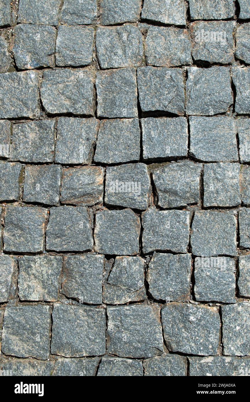 Cobbled granite pavement background, regular shapes of cobbled stone ...