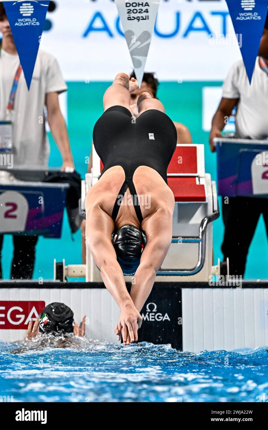 Athletes of team Italy compete in the swimming 4x100m Medley Relay ...
