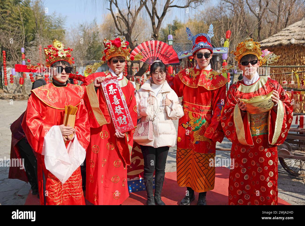 Beijing, China's Shandong Province. 13th Feb, 2024. A tourist poses for ...