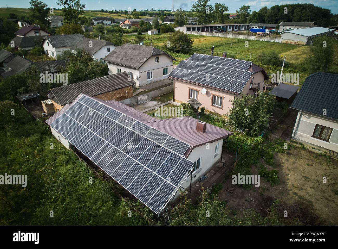 Aerial top view of new modern house cottage with solar photovoltaic ...