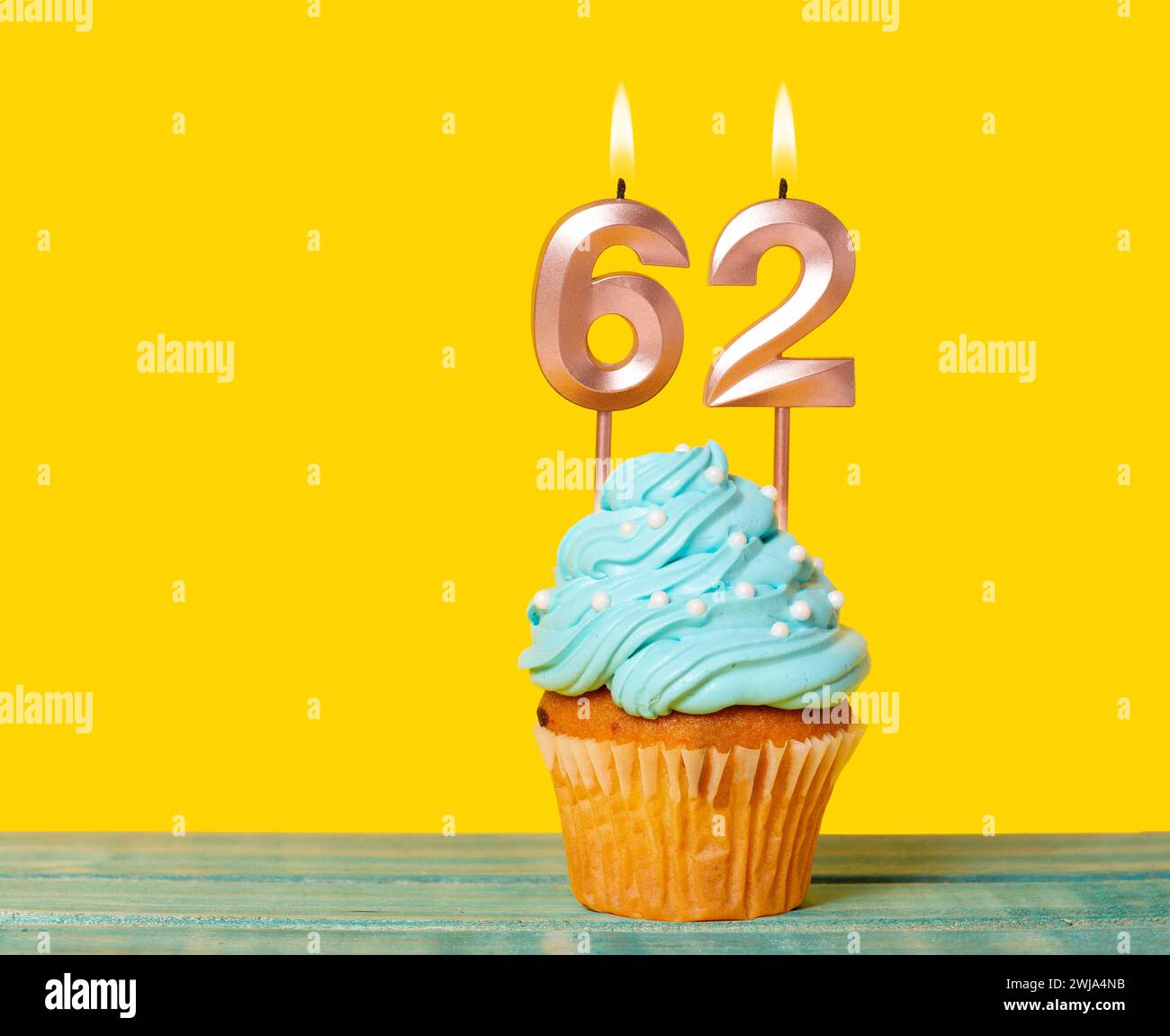 Birthday Cake With Candle Number 62 - On Yellow Background Stock Photo ...