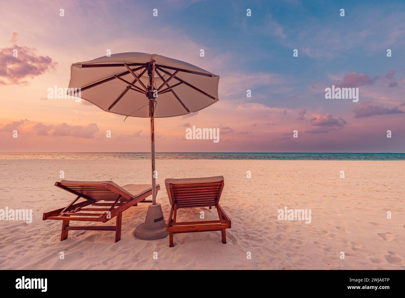 Romantic beach landscape. Couple chairs umbrella sunset sunrise ...