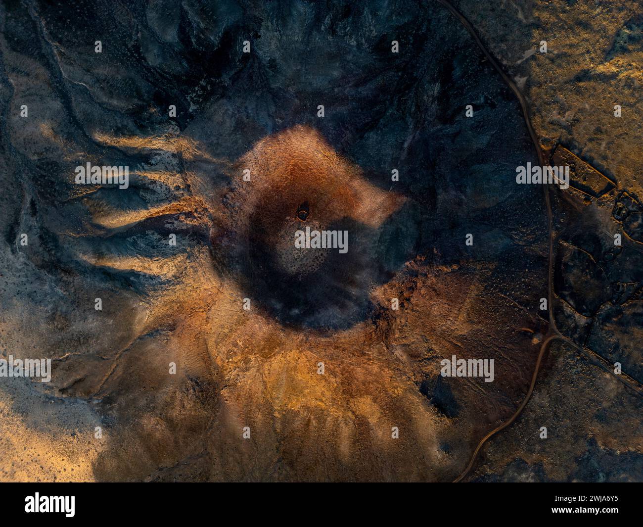 Aerial shot capturing the rugged beauty of a volcanic crater with its ...