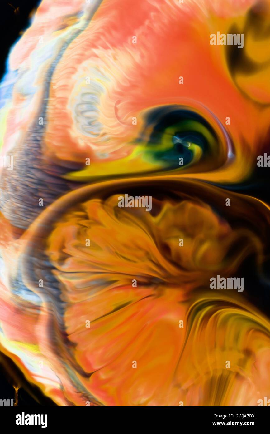 A vibrant abstract image showcasing a blend of warm colors with a fluid ...