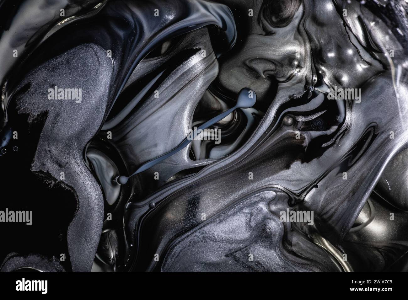 Monochromatic abstract of black and gray swirling inks with subtle ...