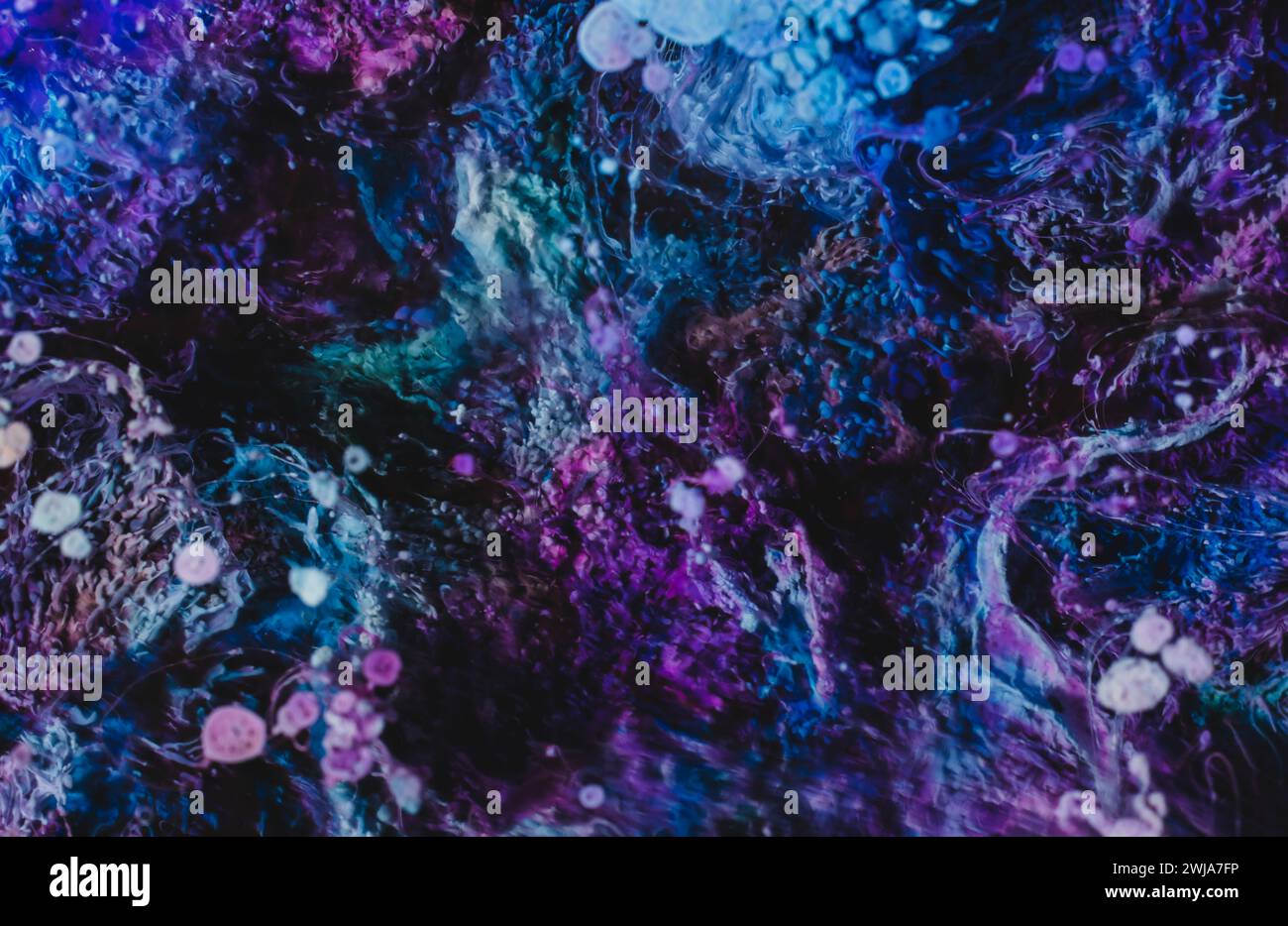 Abstract and vibrant underwater scene with light reflections creating a ...