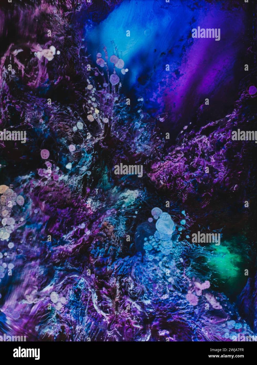 Abstract and vibrant underwater scene with light reflections creating a ...