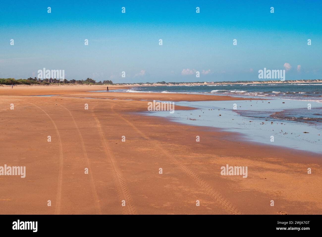 A tourist walking on the sand dunes at Mambrui Sand dunes in Mambrui ...