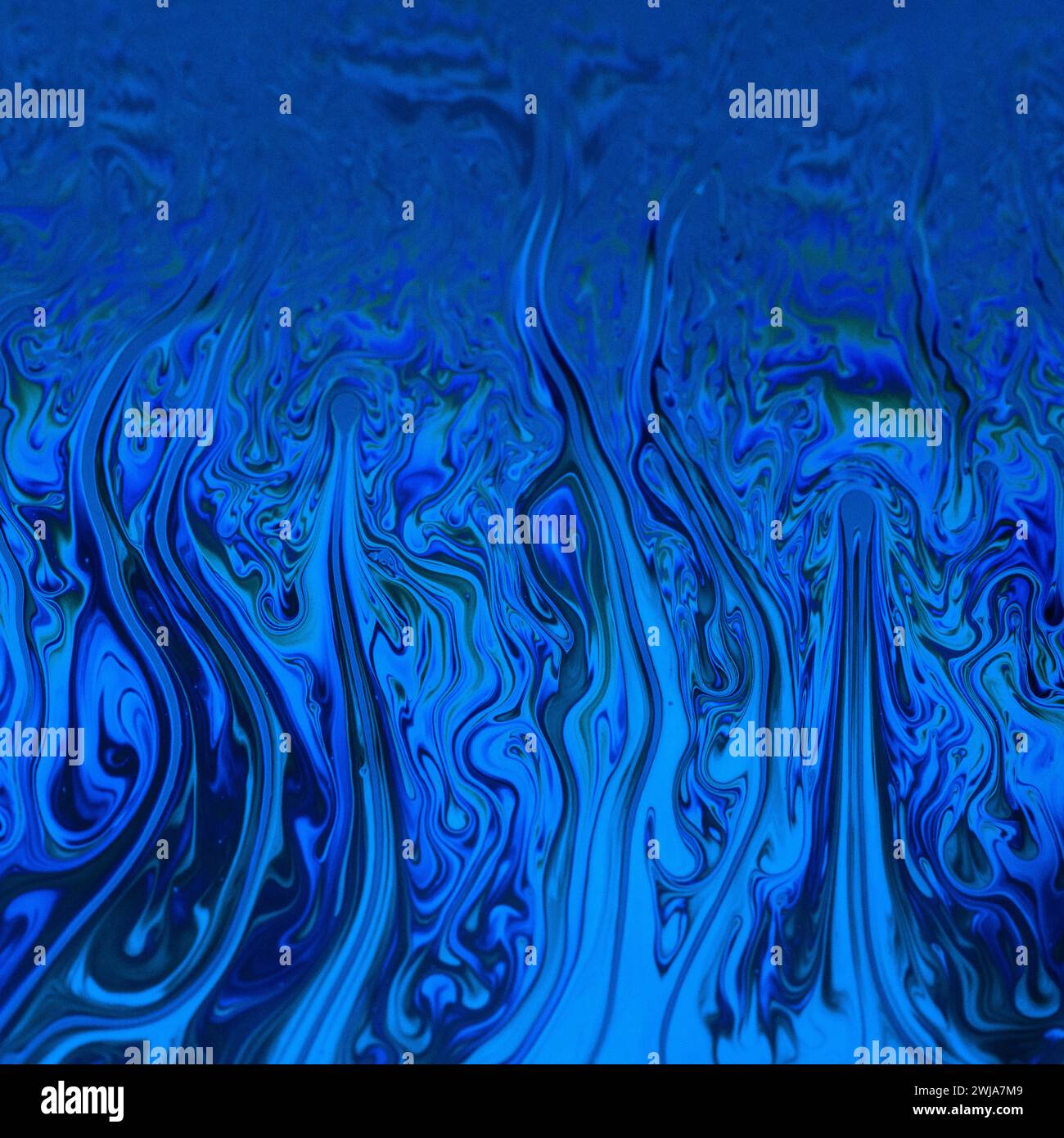 An abstract image featuring intertwining blue and green wave patterns ...