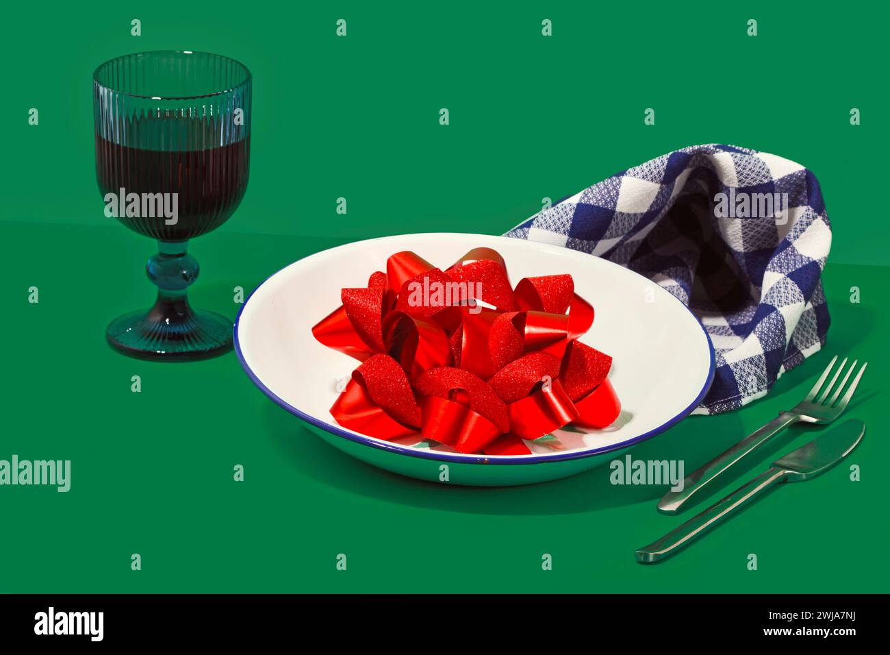 Image featuring a plate filled with glittering red ribbons, a checkered ...