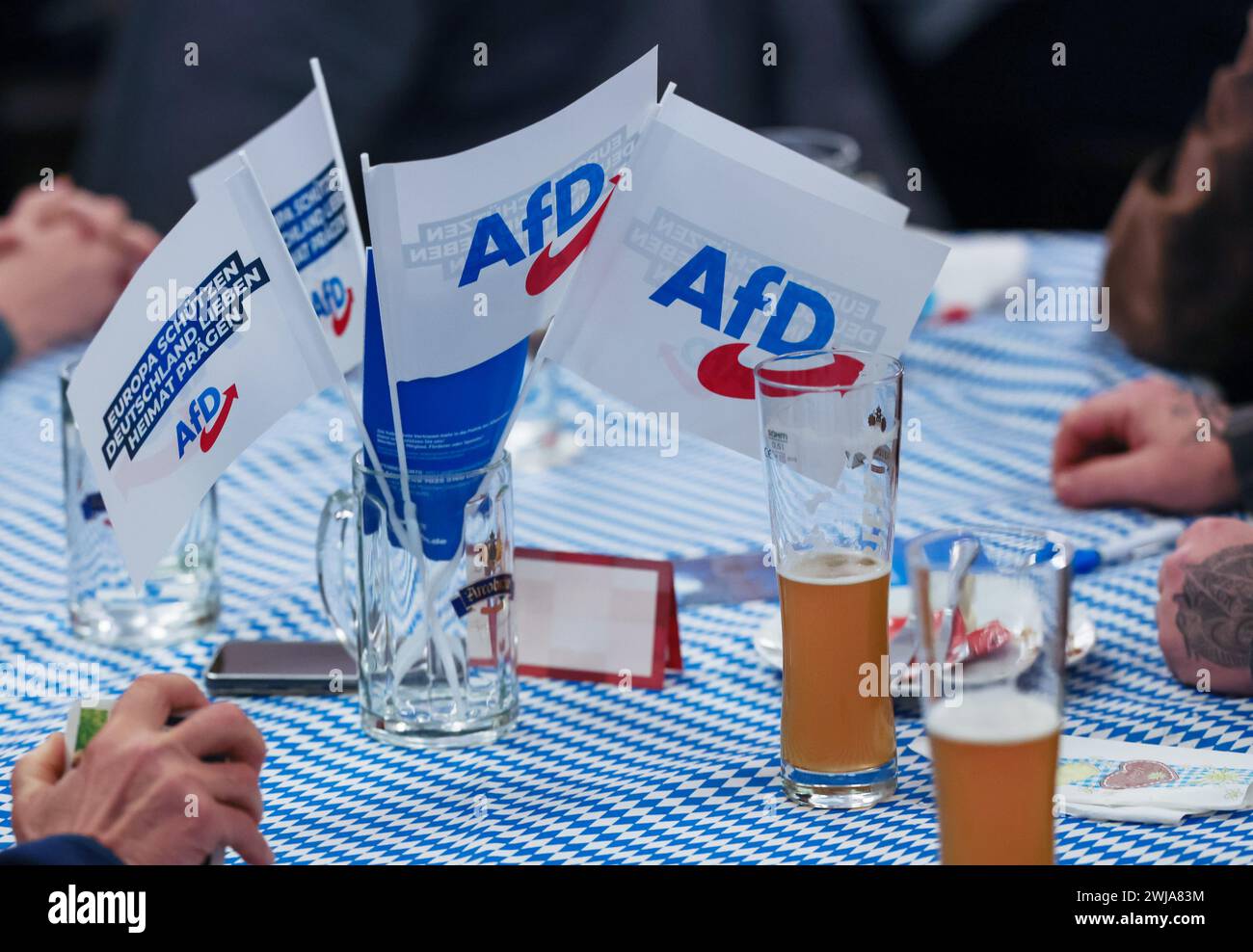 14 February 2024, Bavaria, Osterhofen: AfD party flags are on the beer ...