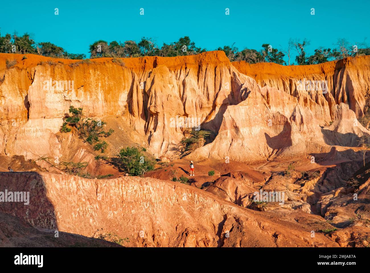 Tourists dwarfed by rock formations at Marafa Depression - Hell's ...