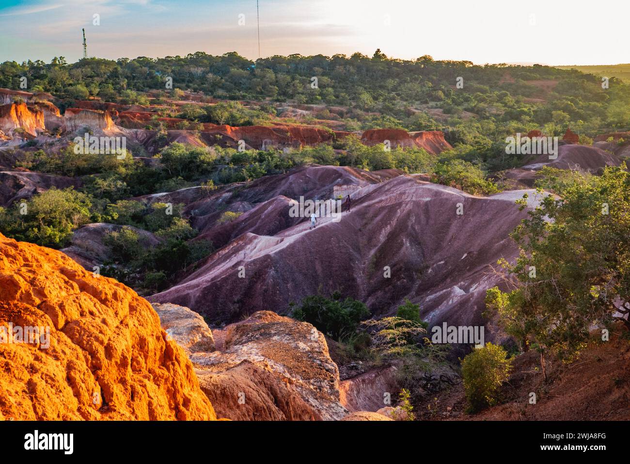 Tourists dwarfed by rock formations at Marafa Depression - Hell's ...