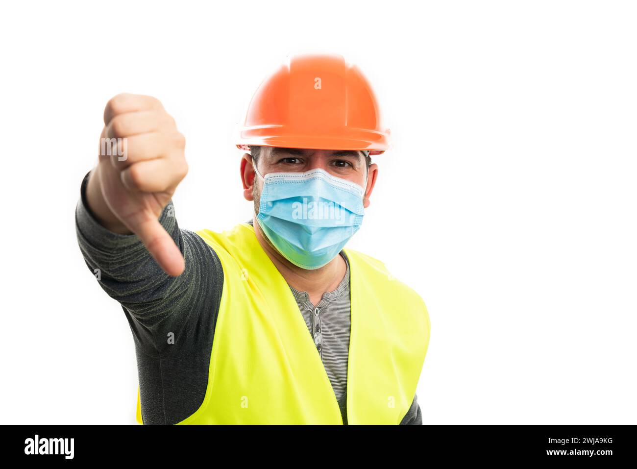 Builder man wearing surgical or medical mask work attire vest and ...