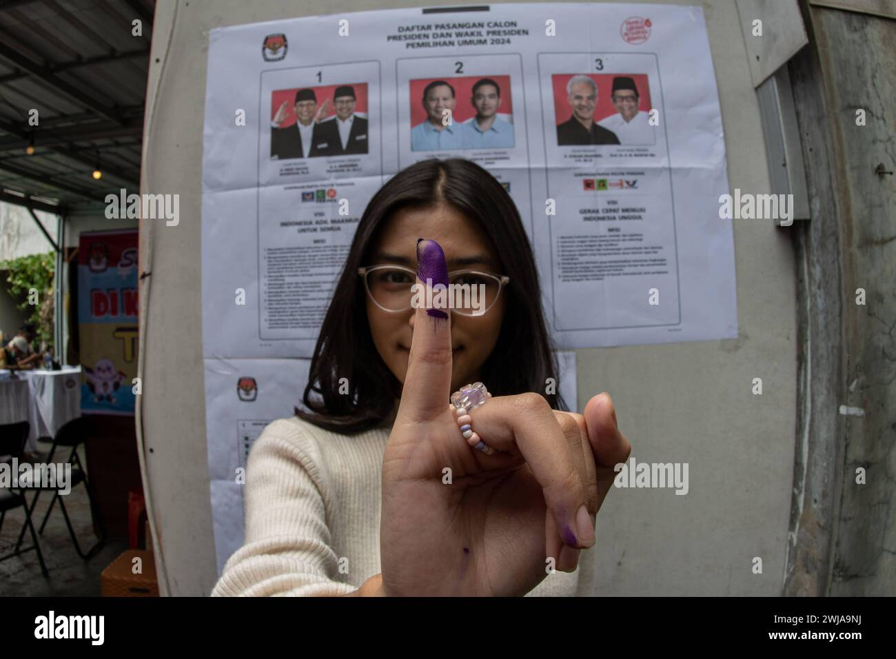INDONESIA GENERAL ELECTION Voters show their inked fingers after voting ...