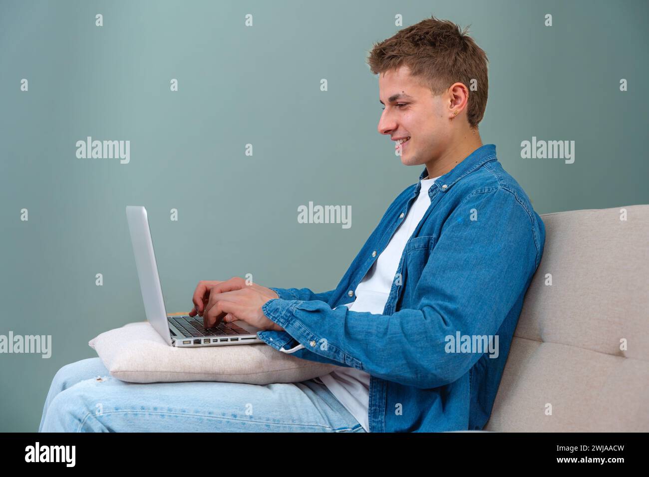 Young student at home in smart working with college classes and lessons ...