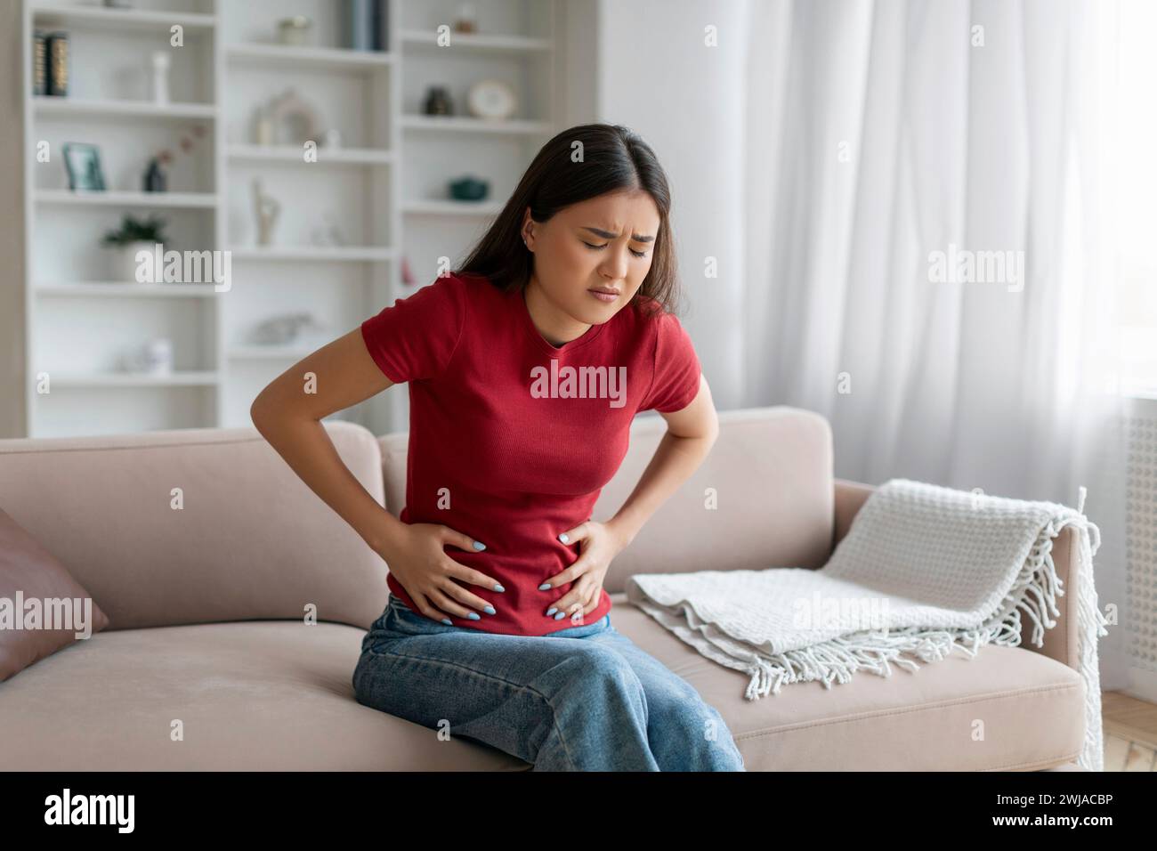 Stomach Ache. Sick Asian Woman Suffering From Acute Abdominal Pain At ...