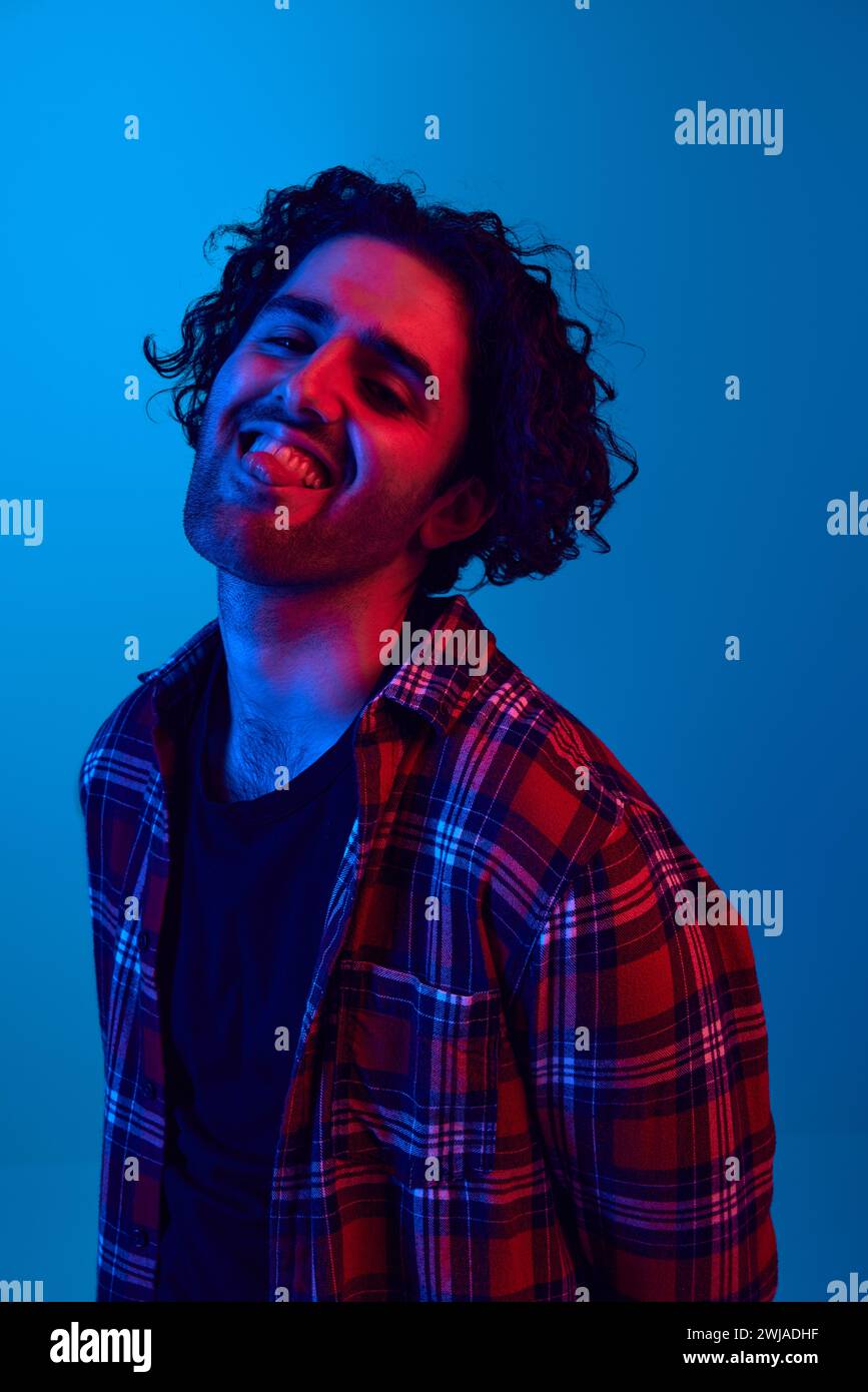 Positive vibe. Gel portrait of cheerful young man with unshaved face ...