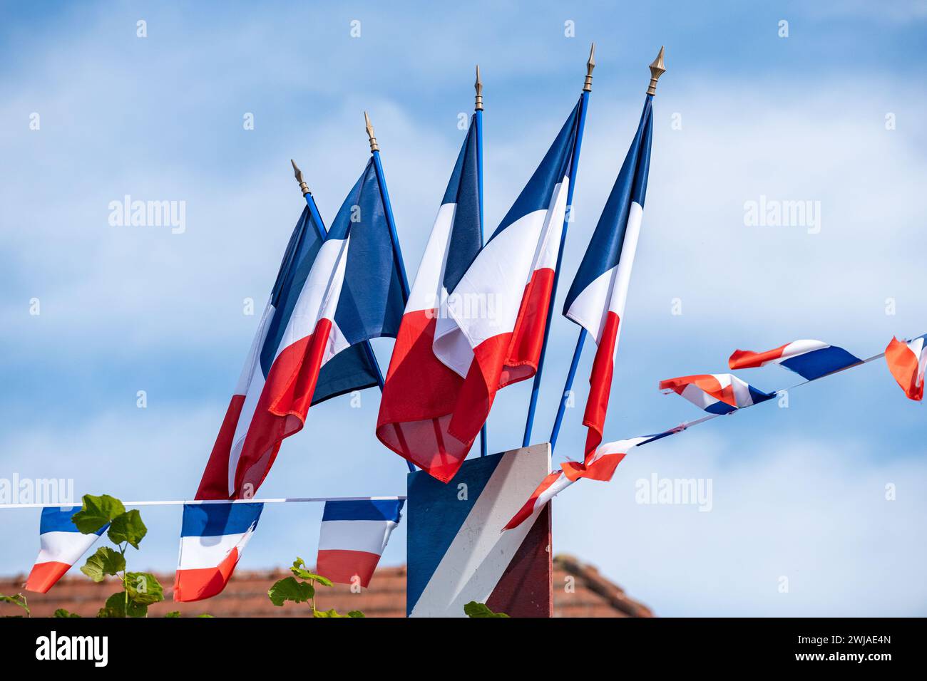 French blue, white and red flags in “place de la mairie” (Townhall ...