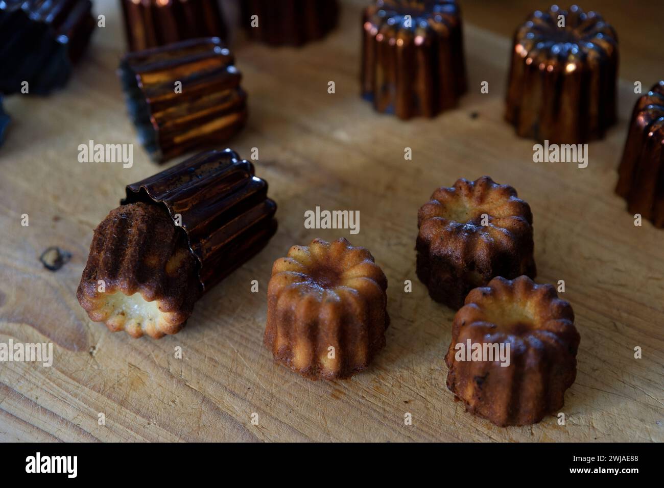 Specialty pastries from Bordeaux. Cannelé Bordelais traditional copper ...