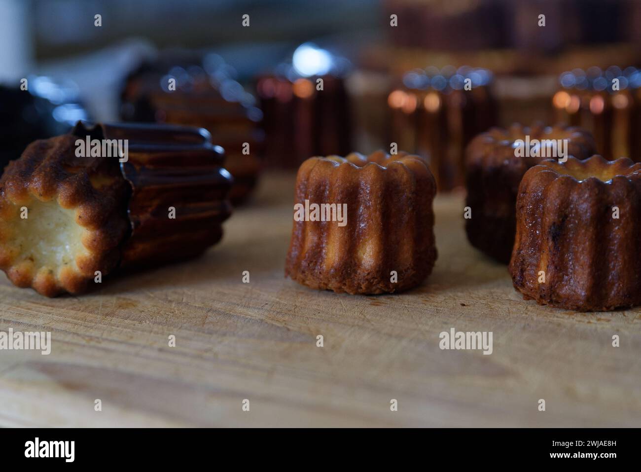 Specialty pastries from Bordeaux. Cannelé Bordelais traditional copper ...
