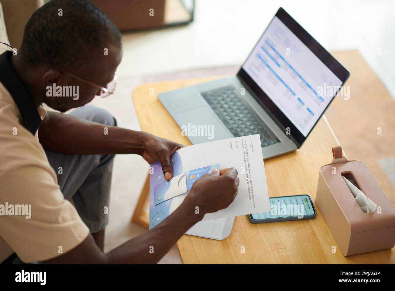 Customer opening letter with credit card from bank Stock Photo - Alamy
