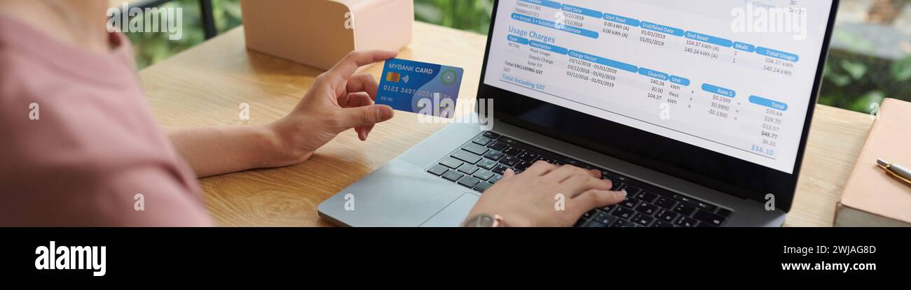 Web banner with woman paying utility bills with credit card Stock Photo ...