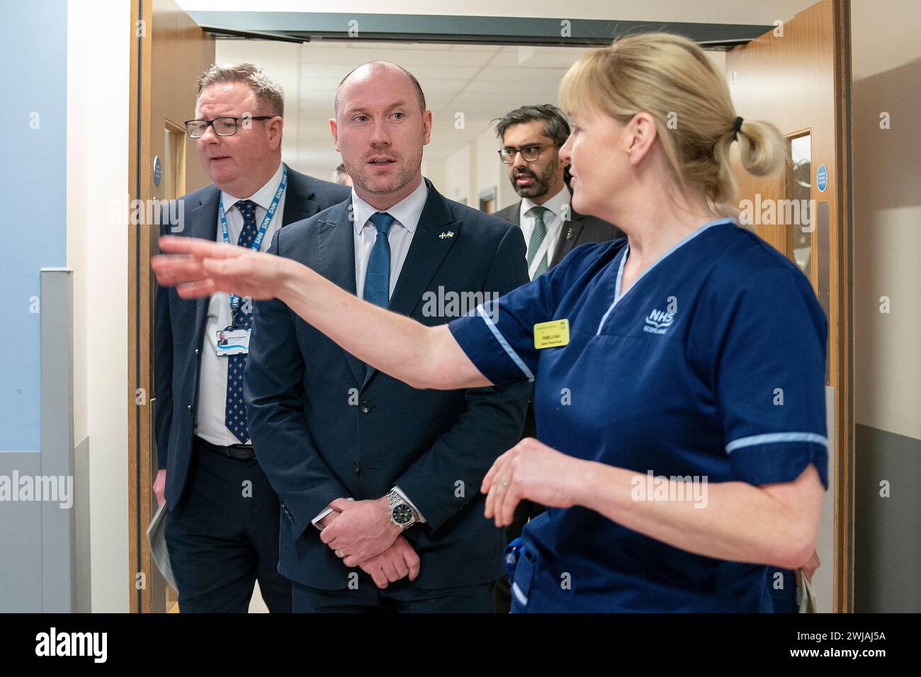 Scottish Health Secretary Neil Gray (centre) meets staff working in the ...