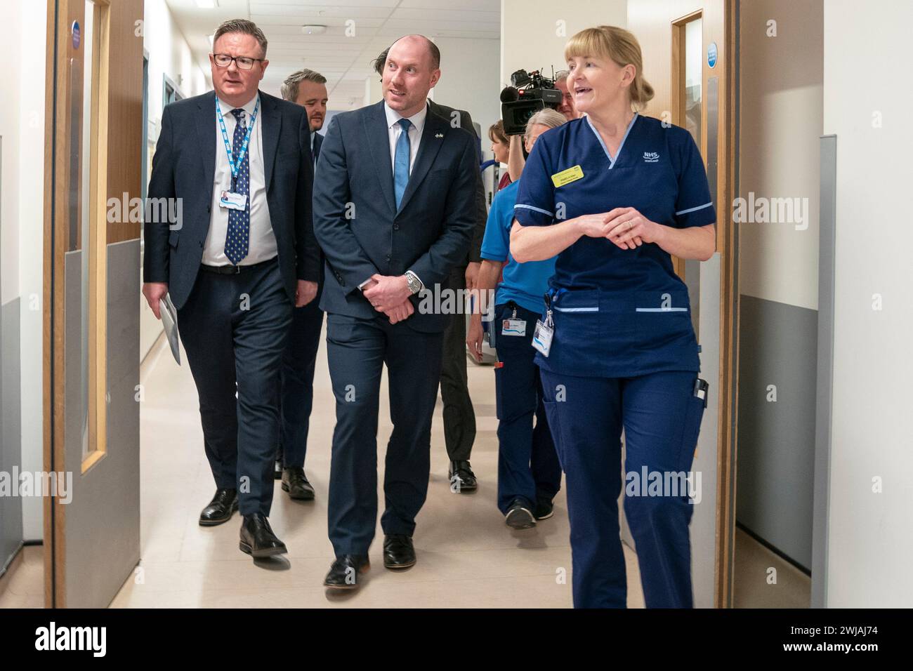 Scottish Health Secretary Neil Gray (centre) meets staff working in the ...
