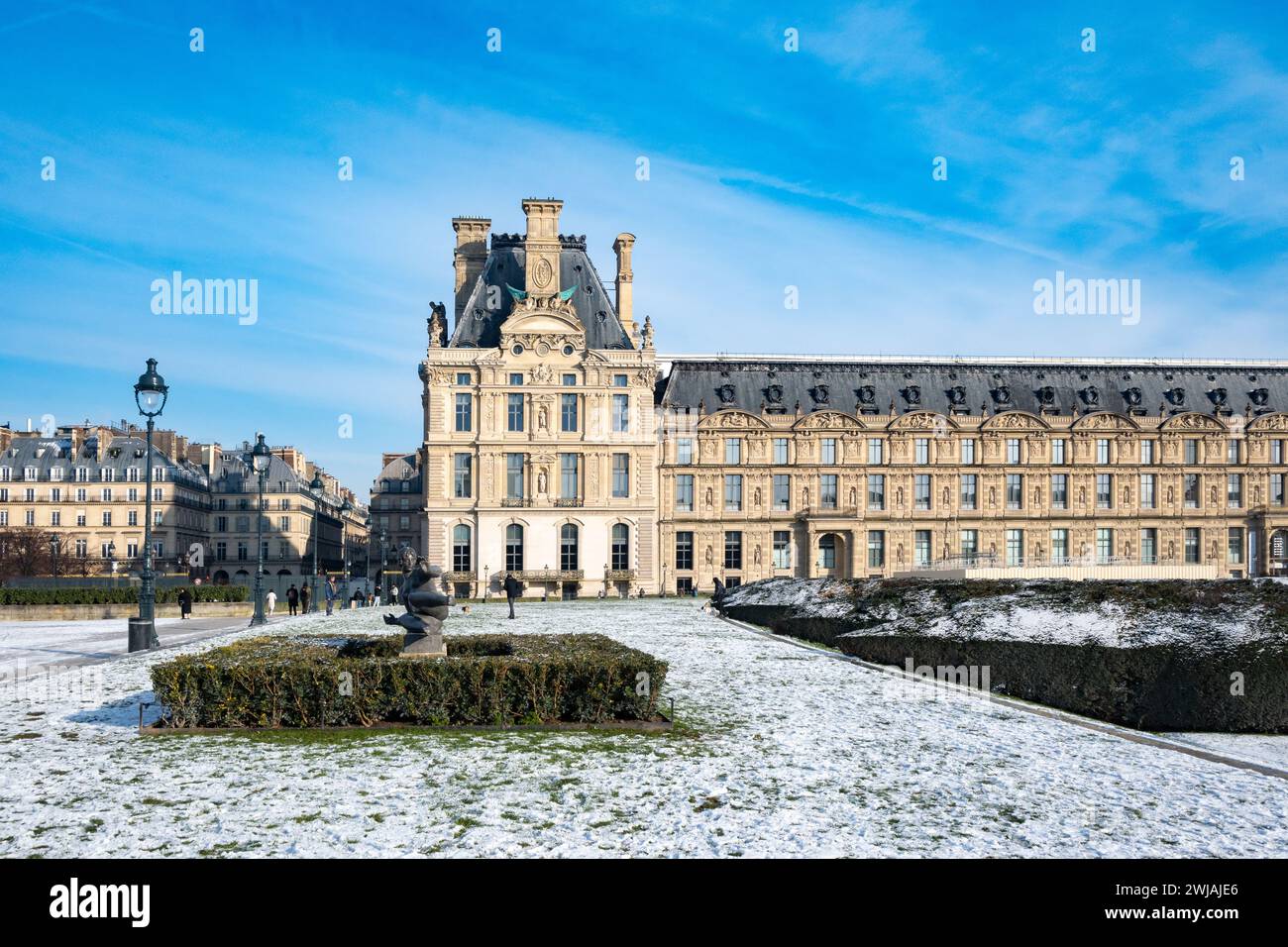 Paris, France, Landscape with Louvre Museum and snowy lawn, Editorial ...