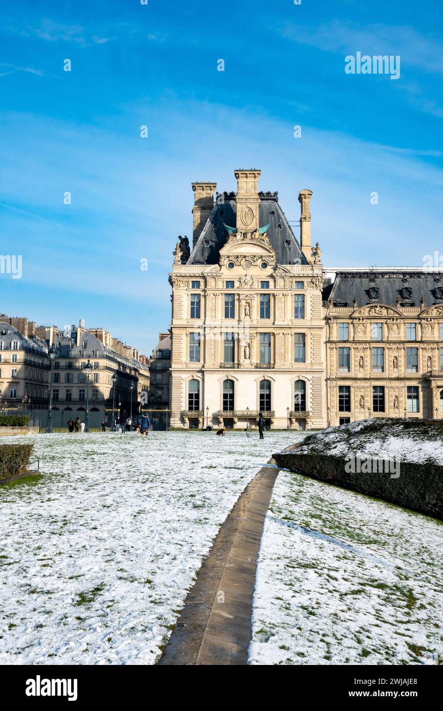 Paris, France, Landscape with Louvre Museum and snowy lawn, Editorial ...