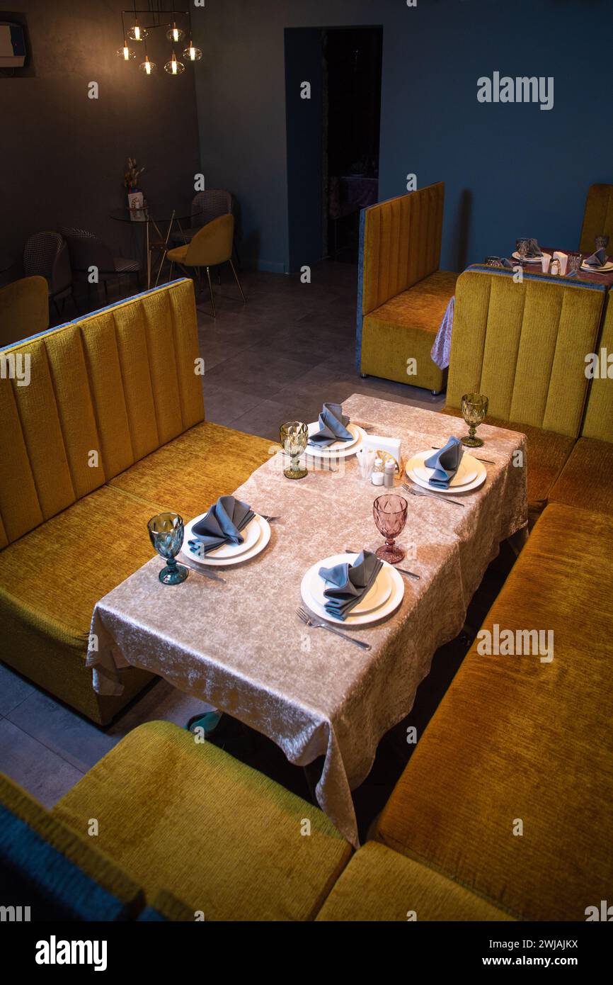 This image showcases an elegant restaurant interior with a table set ...