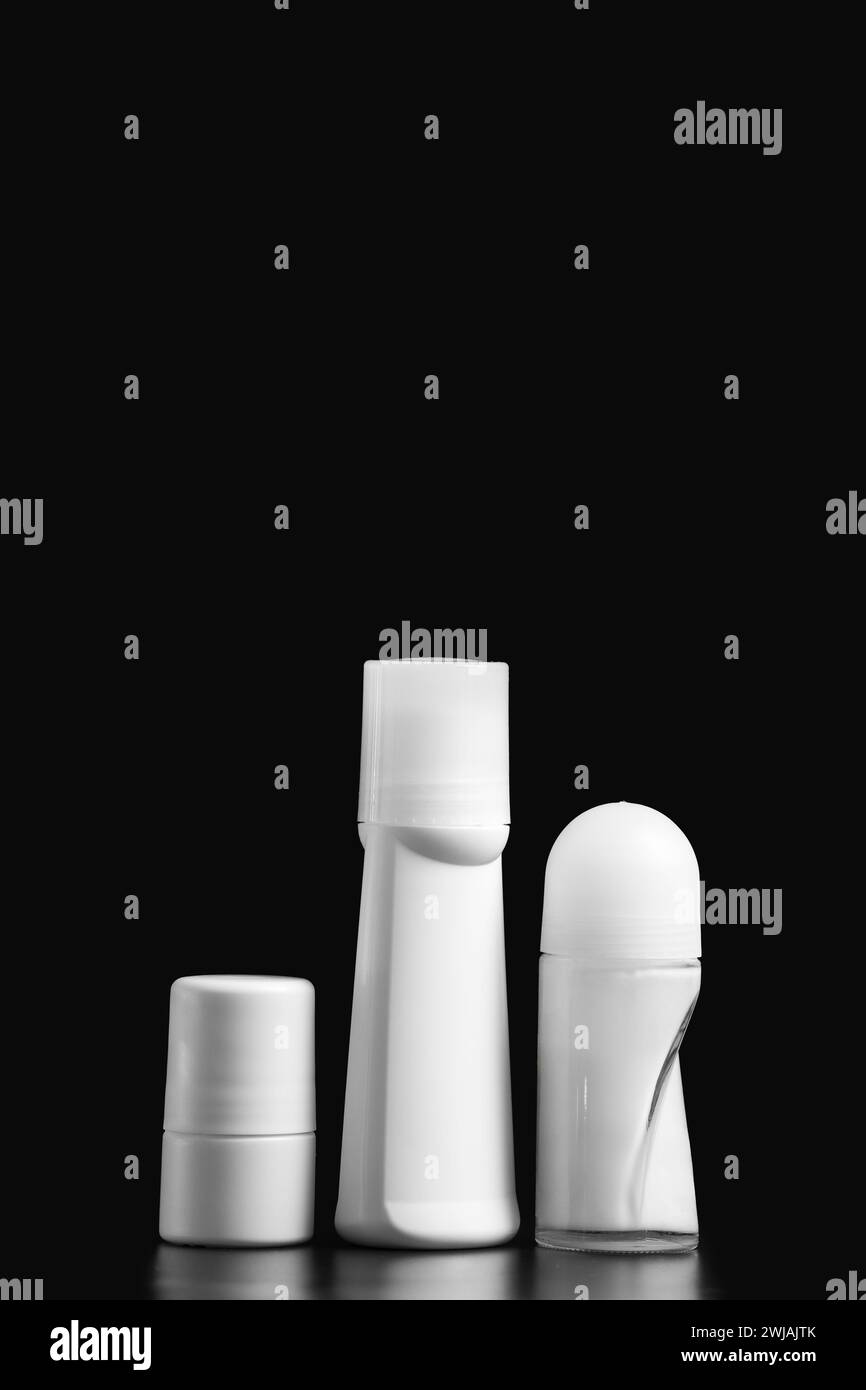 Set of white antiperspirant deodorant roll-on, isolated on black ...