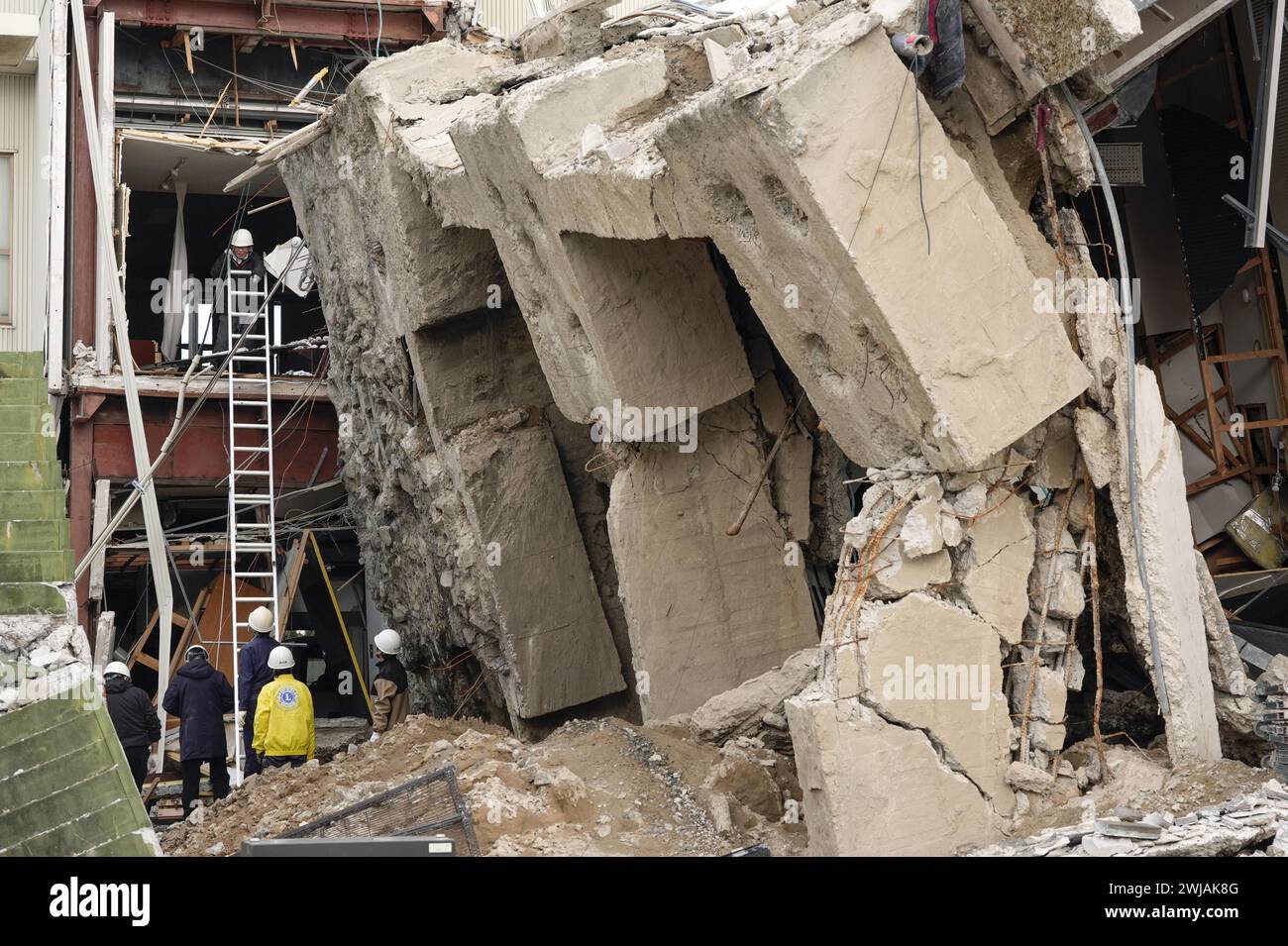 Photo taken on Feb. 14, 2024, shows the site of a toppled building in ...