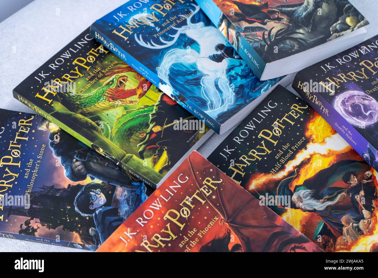 A stack of books about Harry Potter by writer JK Rowling. Collection ...