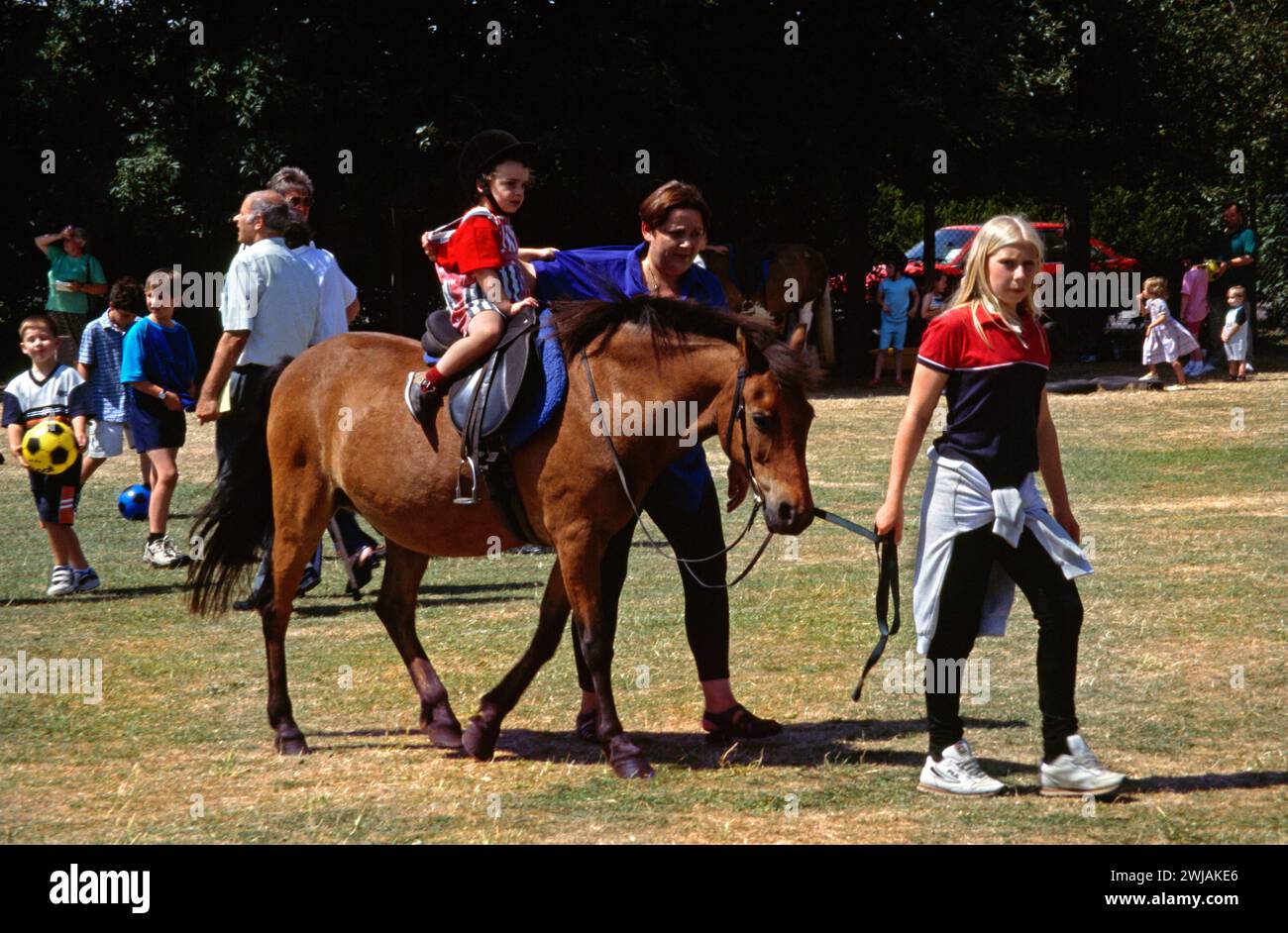 Children on Pony Rides at School Fete at Local Park Surrey England ...