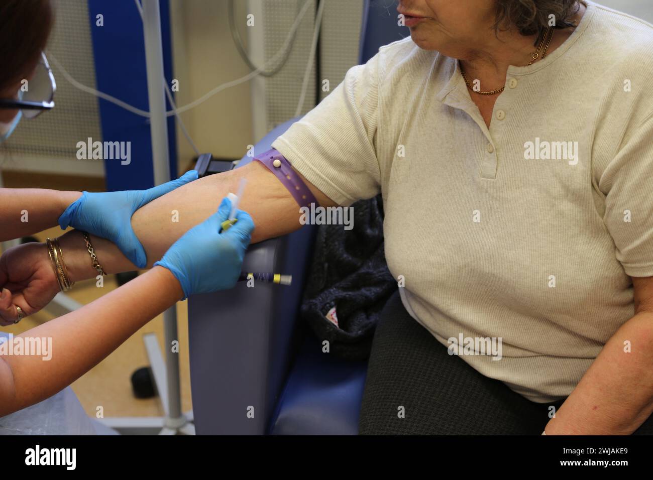 Nurse Inserting a Cannula into Patient Ready to Administer Ferinject ...