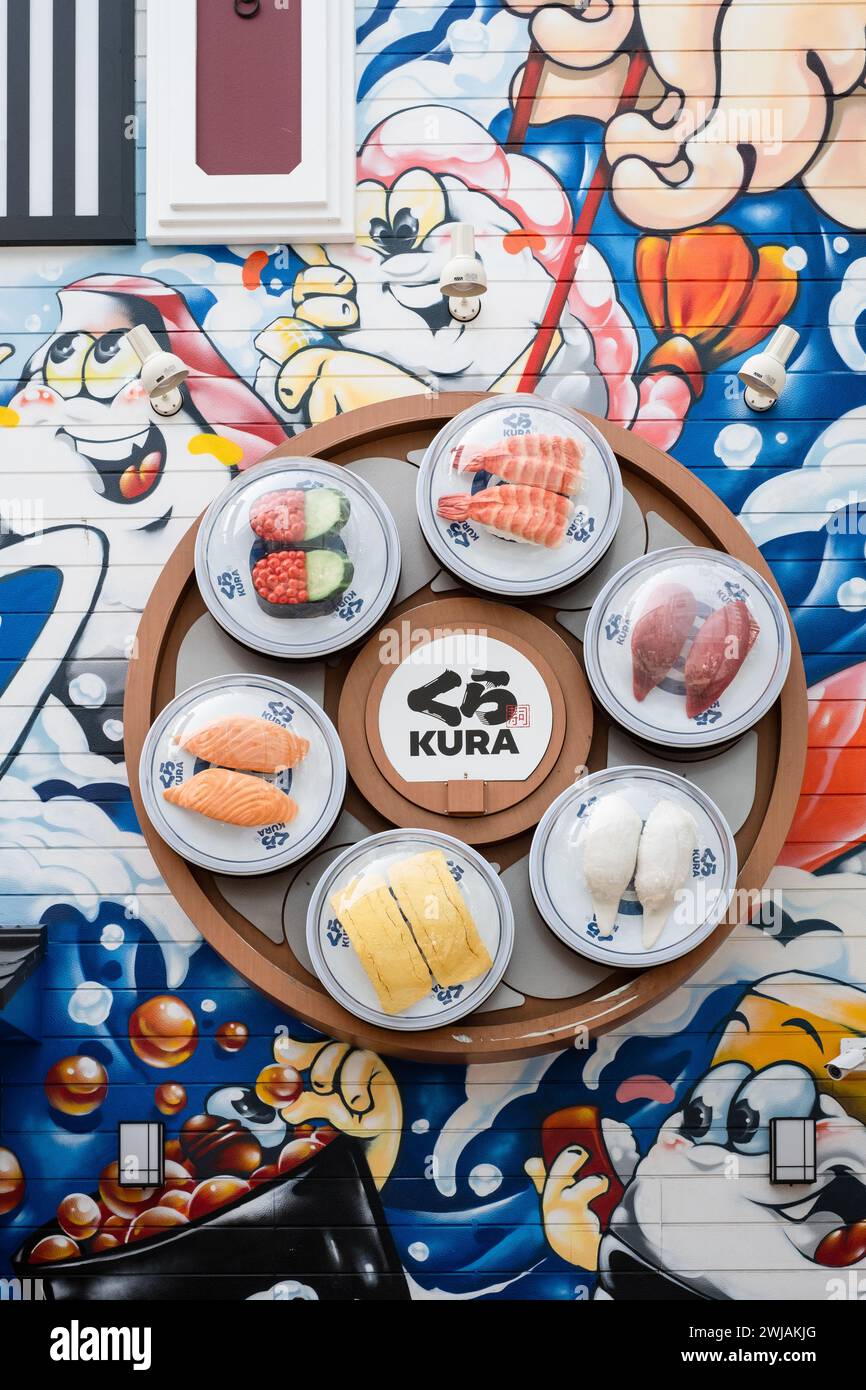 Kura Sushi giant plastic food and street art advertising near ...