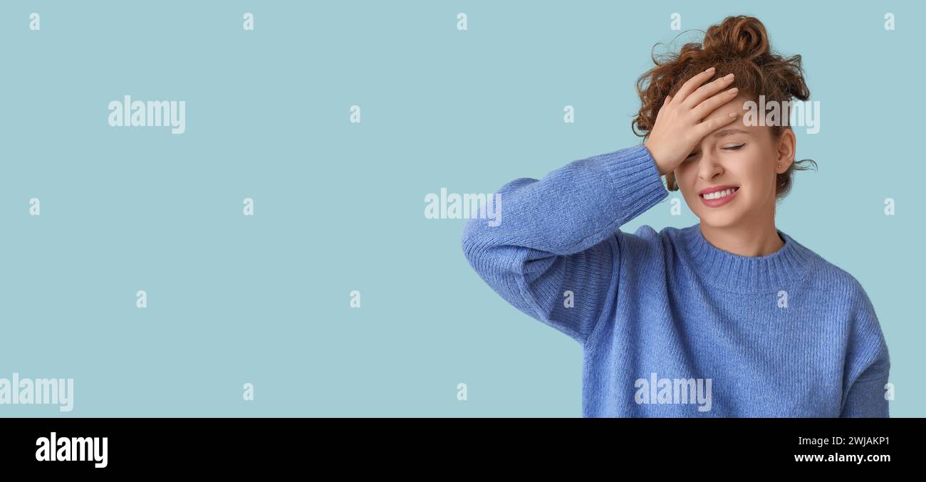 Young woman feeling awkward on light blue background with space for ...