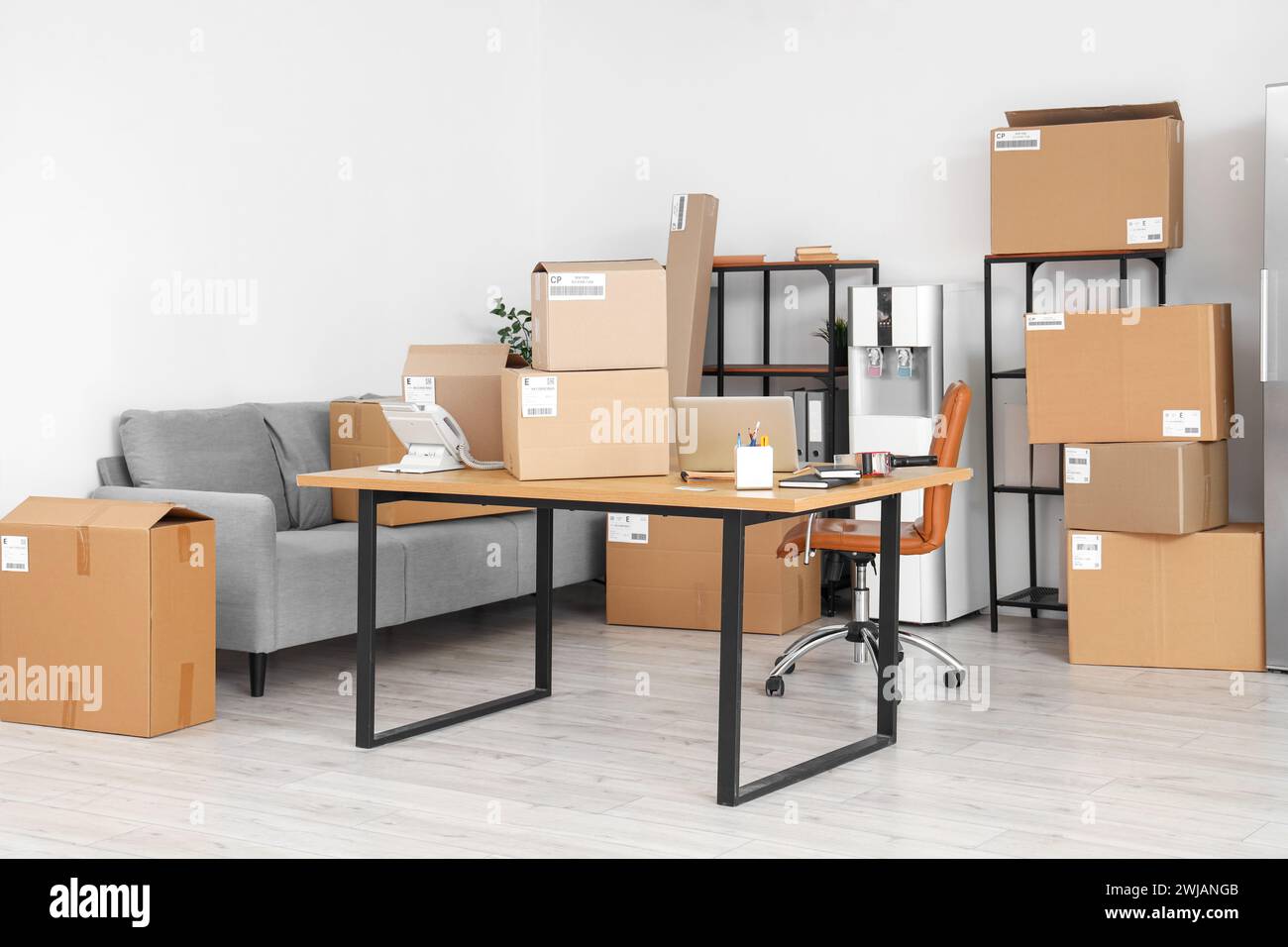 Interior of warehouse store with parcels and workplace Stock Photo - Alamy