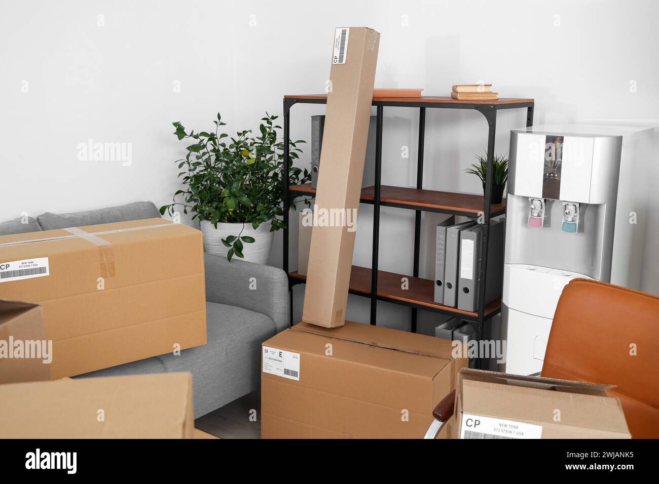 Interior of warehouse store with parcels and shelf unit Stock Photo - Alamy